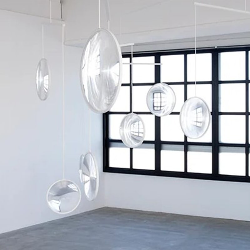 yuji okitsu’s mobile lenses sway and rotate to diffuse natural light ...