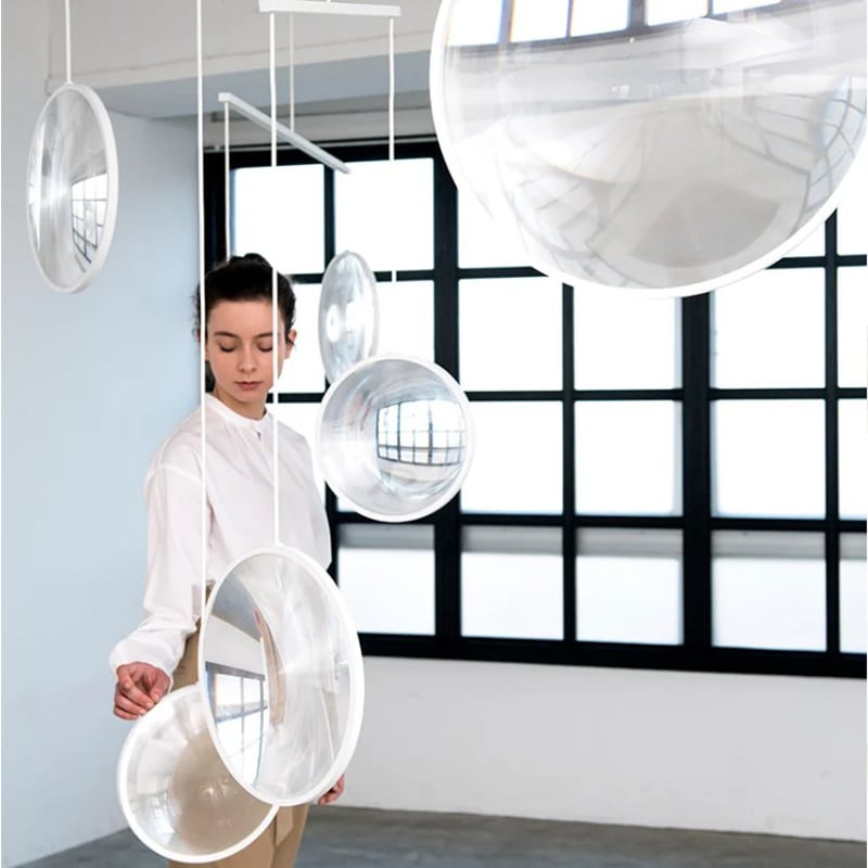 yuji okitsu’s mobile lenses sway and rotate to diffuse natural light ...